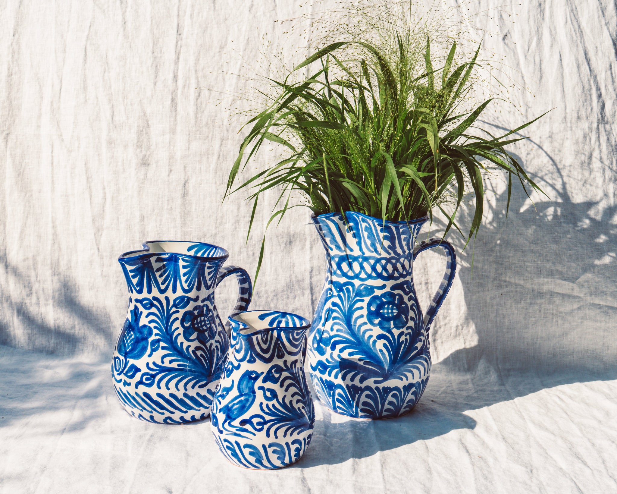 Small pitcher with hand painted designs– Liza Pruitt